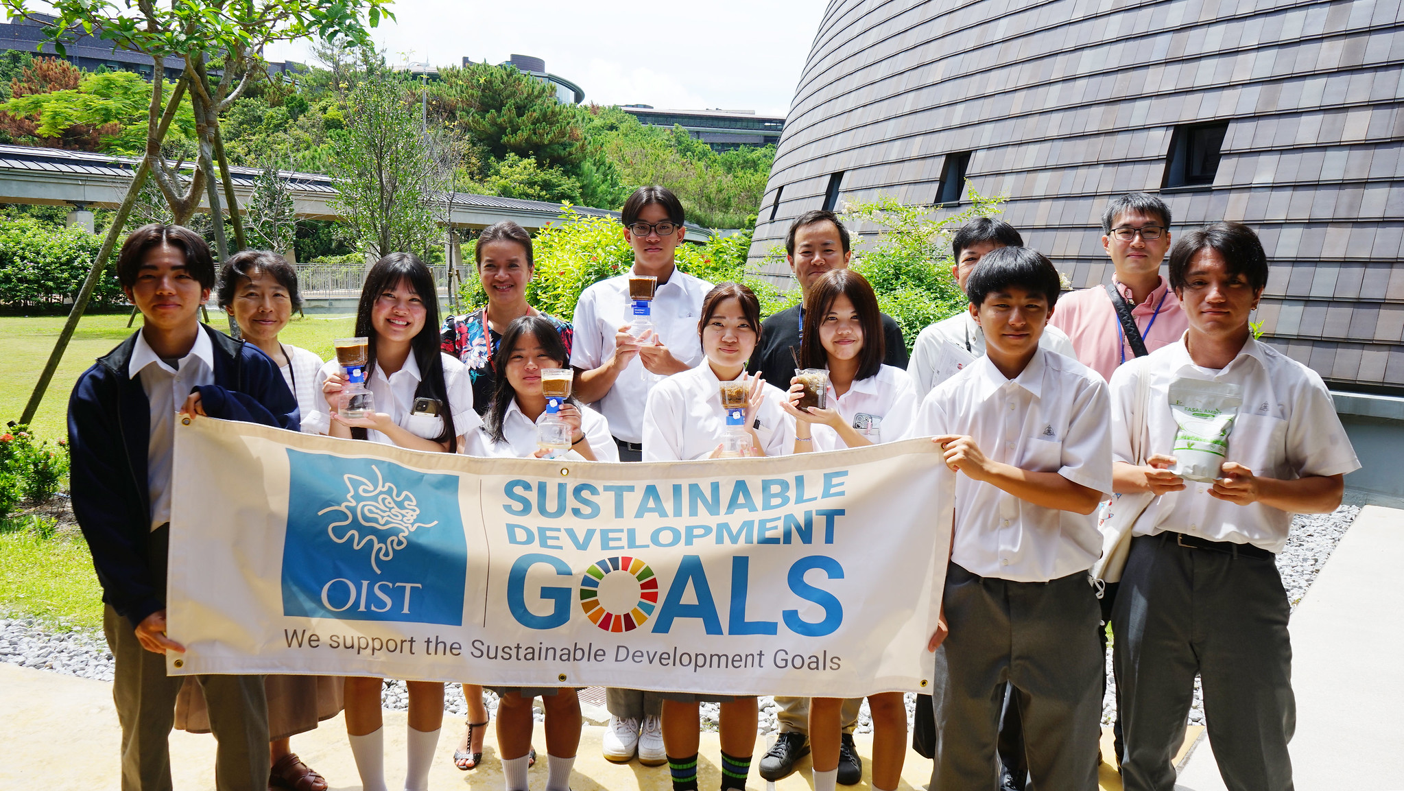 High School Students holding SDGs banner | Okinawa Institute of Science and Technology OIST