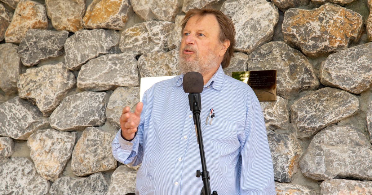Ken Peach gives a concluding speech at plaque unveiling ceremony, which ...