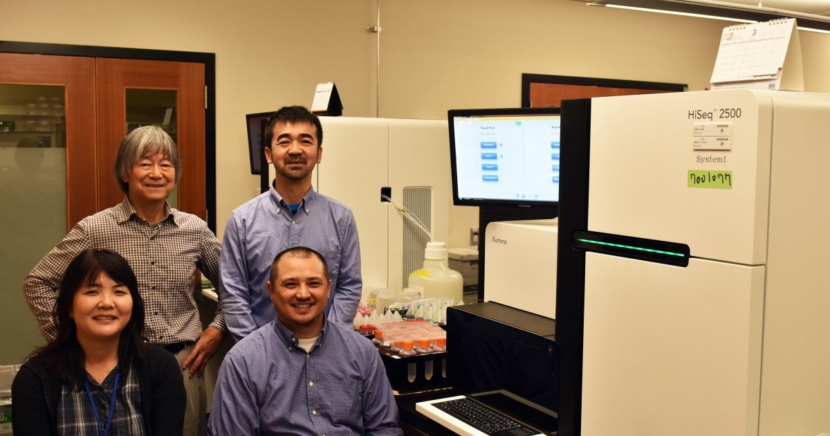 Members of the OIST Marine Genomics Unit next to the next-generation ...